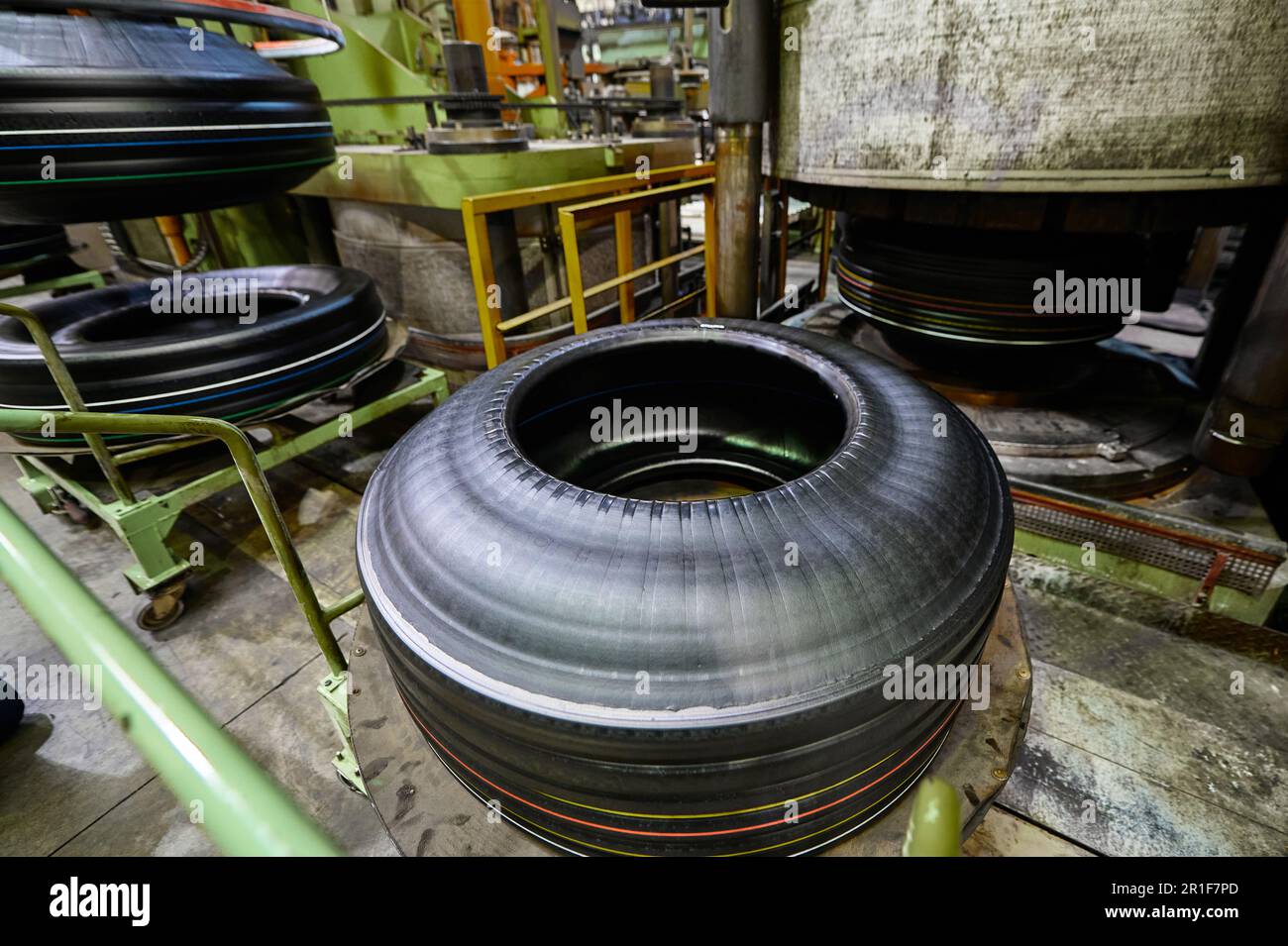 Huge raw tire before vulcanization process by press machine Stock Photo ...