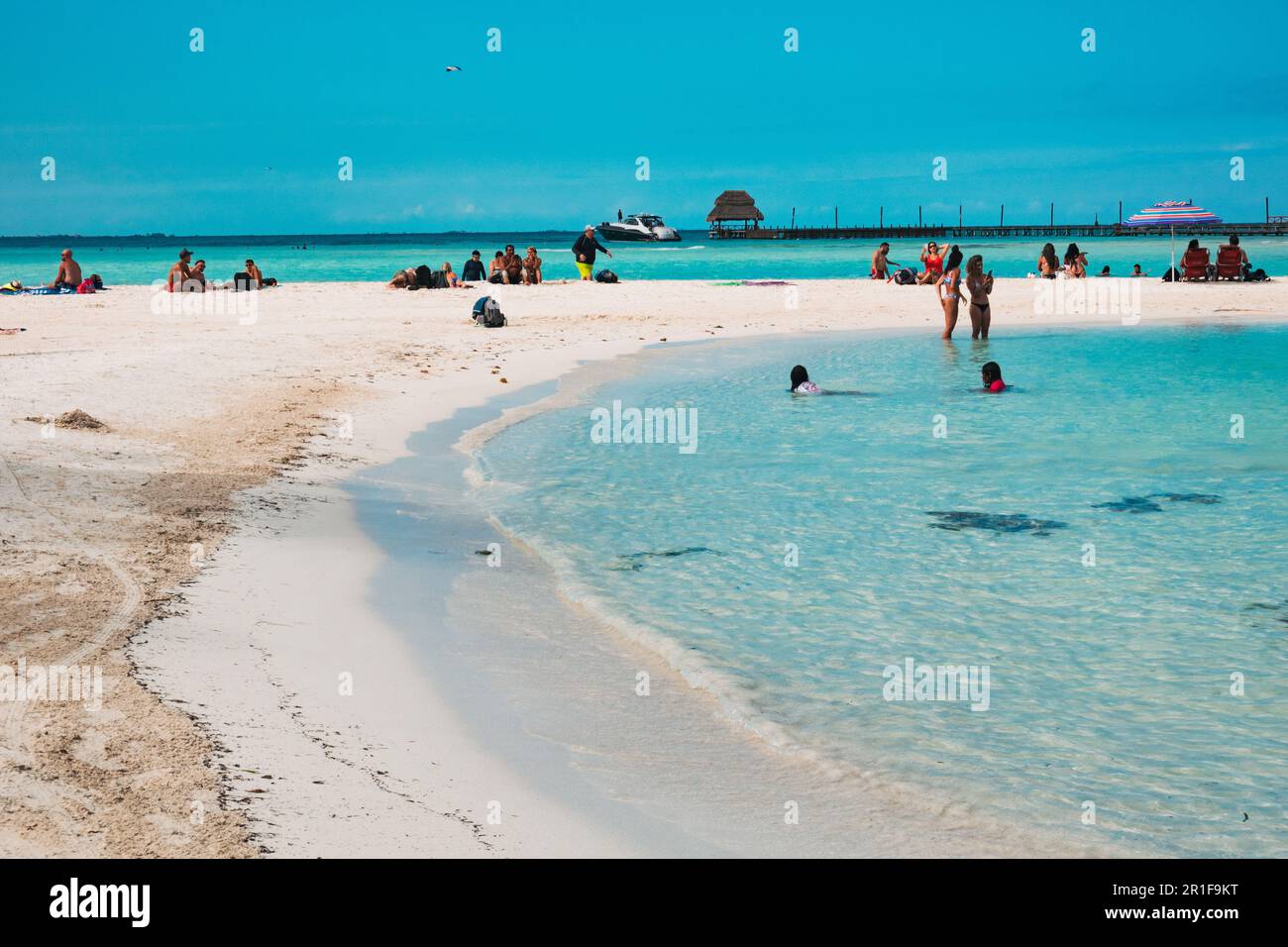 holidaymakers relax by a lagoon next to the MÍA Reef resort on the ...