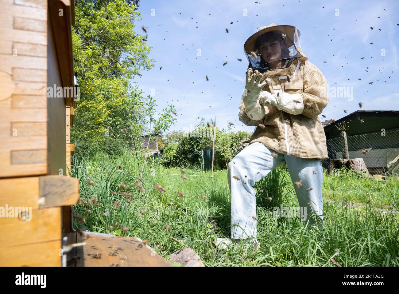 Wiesbaden, Germany. 04th May, 2023. Beekeeper Lilian Hurth stands in ...