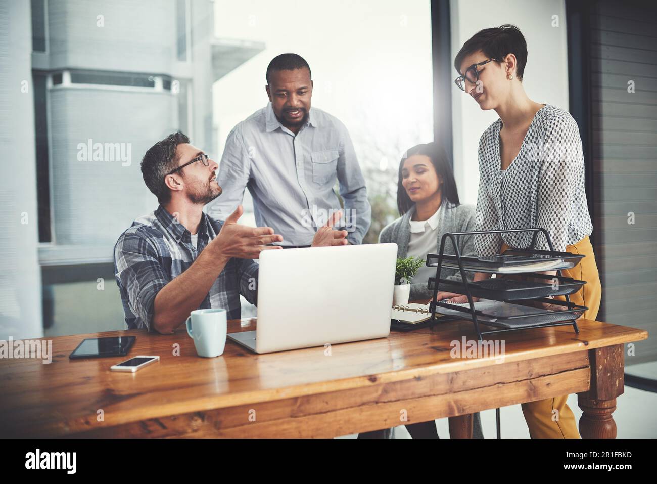 Planning, laptop and coaching with business people in meeting for project management, review or ...