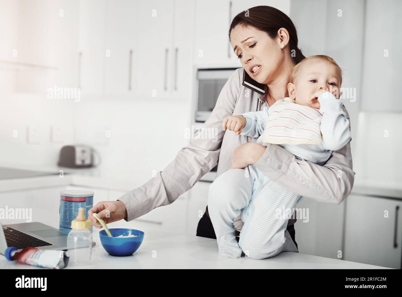 Frustrated, baby and mother busy multitasking in home with phone, food ...