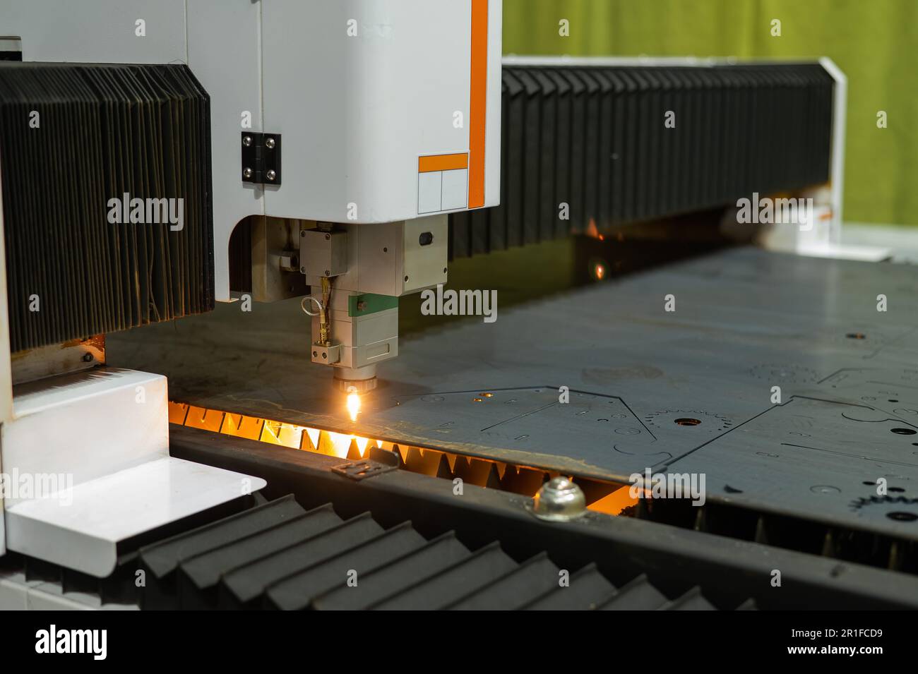 CNC machine. Laser cutting of metal. Sparks Stock Photo - Alamy