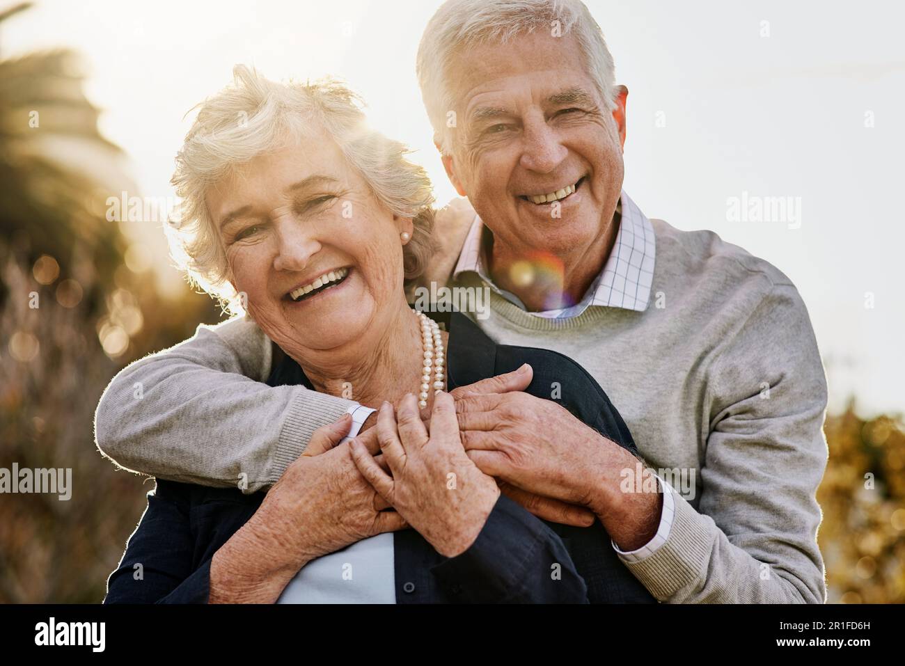 Hug, nature and portrait of senior couple enjoying bonding, faces and ...