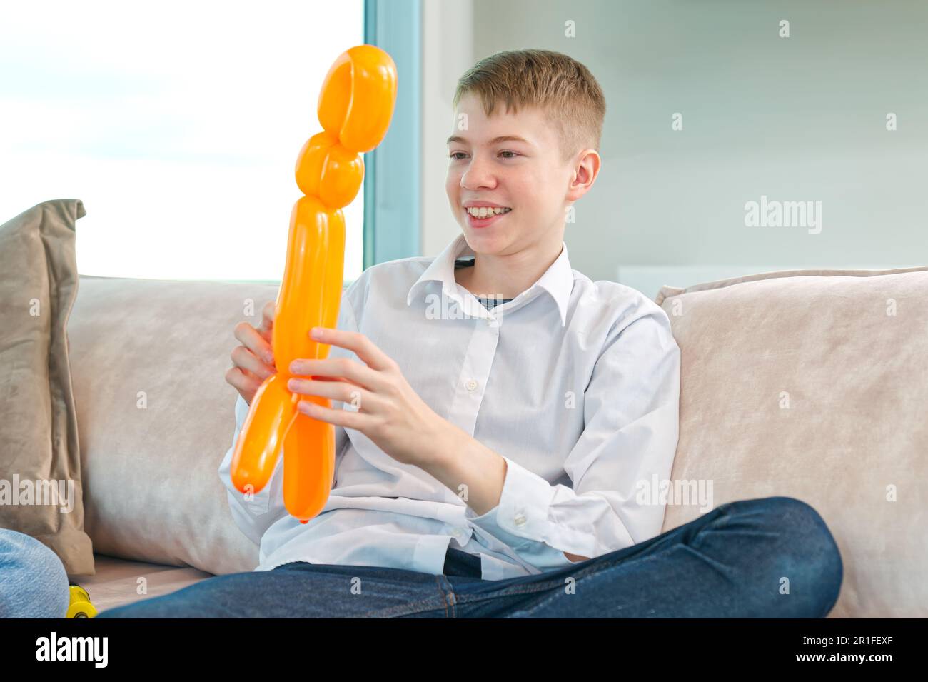 Children inflate modelling balloons. kids having fun with balloons ...