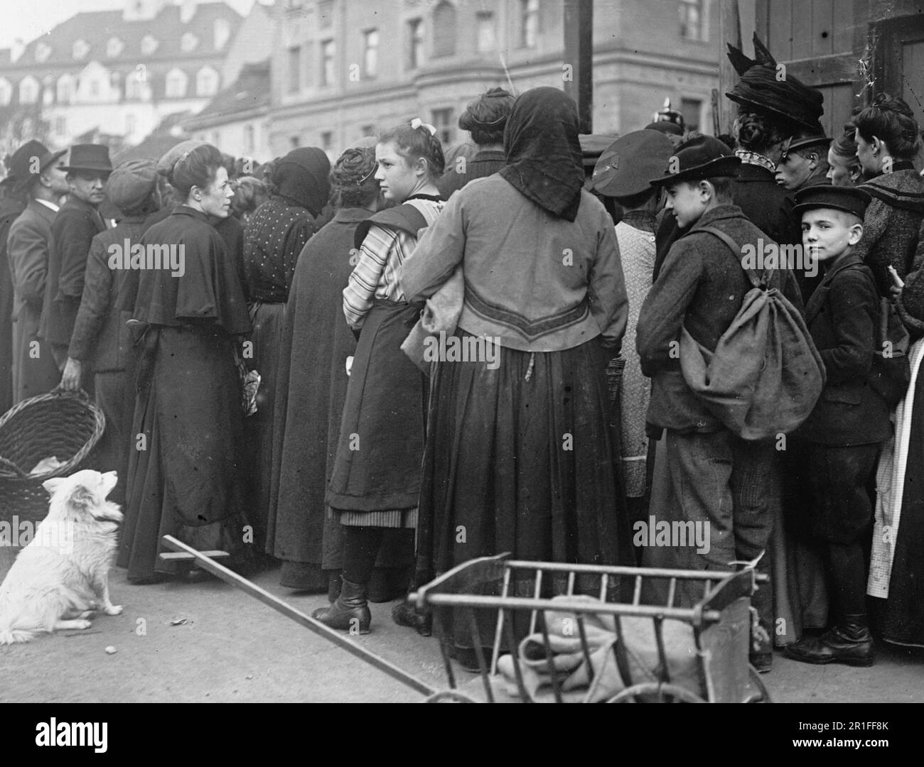 Archival Photo: Women and children standing in a bread line in an ...