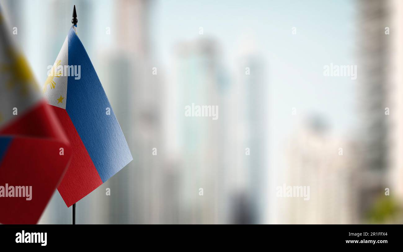 Small flags of the Philippines on an abstract blurry background Stock ...