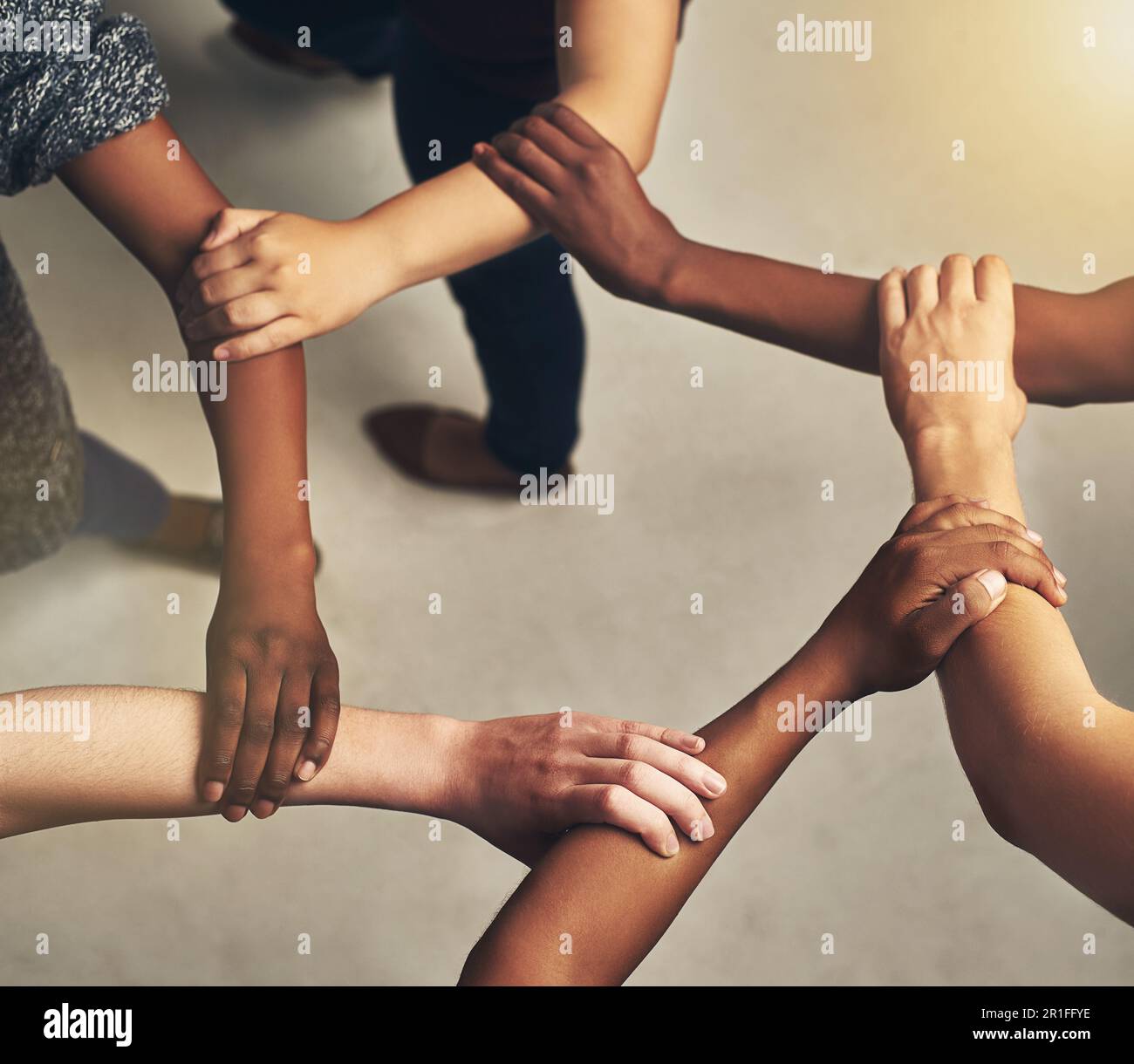 Collaboration, arms in a circle and business people in the office from ...