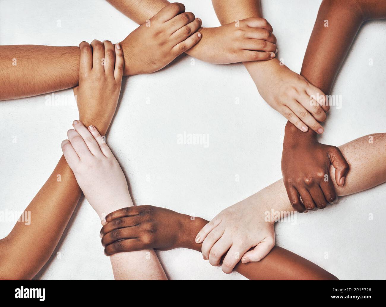 People, integration and hands together isolated on a white background in solidarity, support and ...