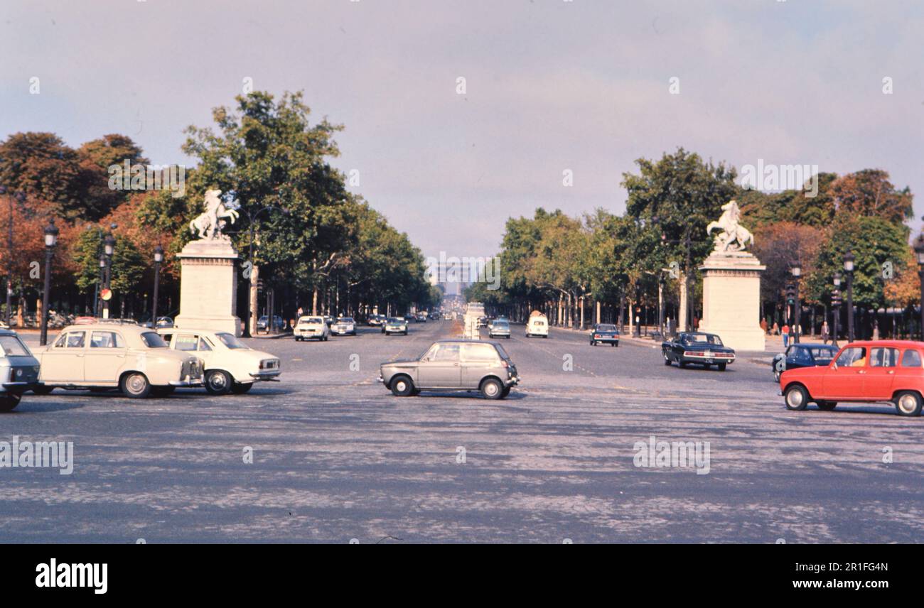 Cars on the Champs Elysees in Paris France, the Arch de Triomphe in the ...