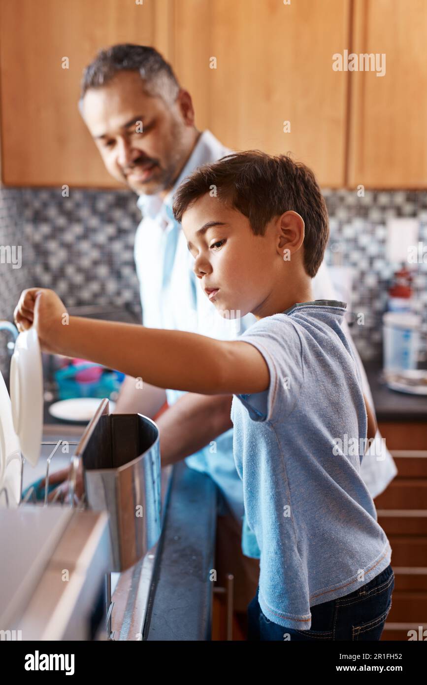 Home, father and son washing dishes, family and help with development ...