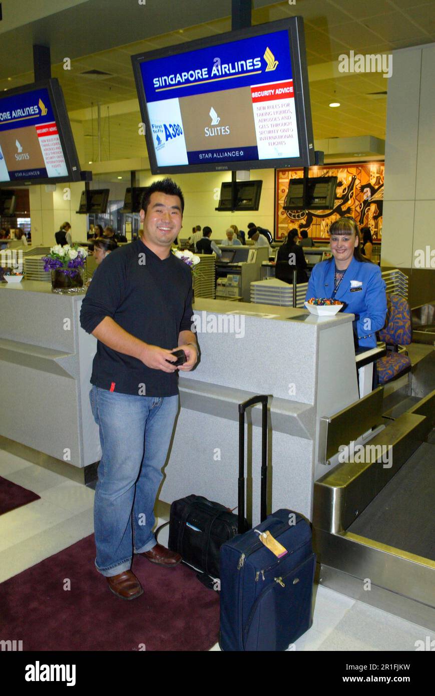 Passenger Sam Chui checks-in for his Suite-class flight aboard the ...