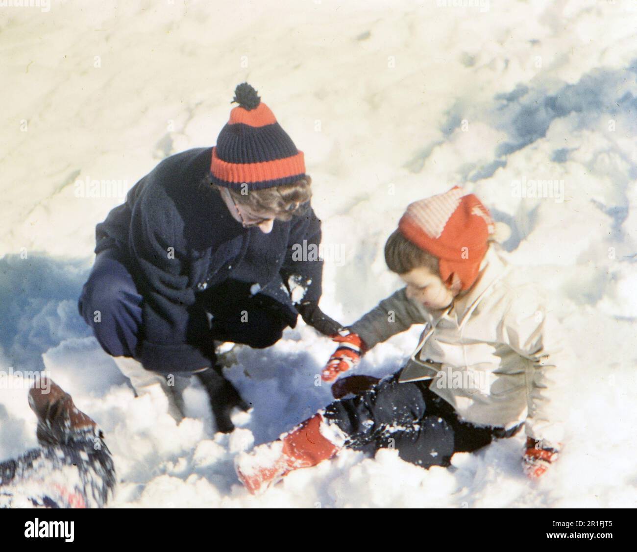 Two boys playing in the snow ca. 1955-1959 Stock Photo - Alamy