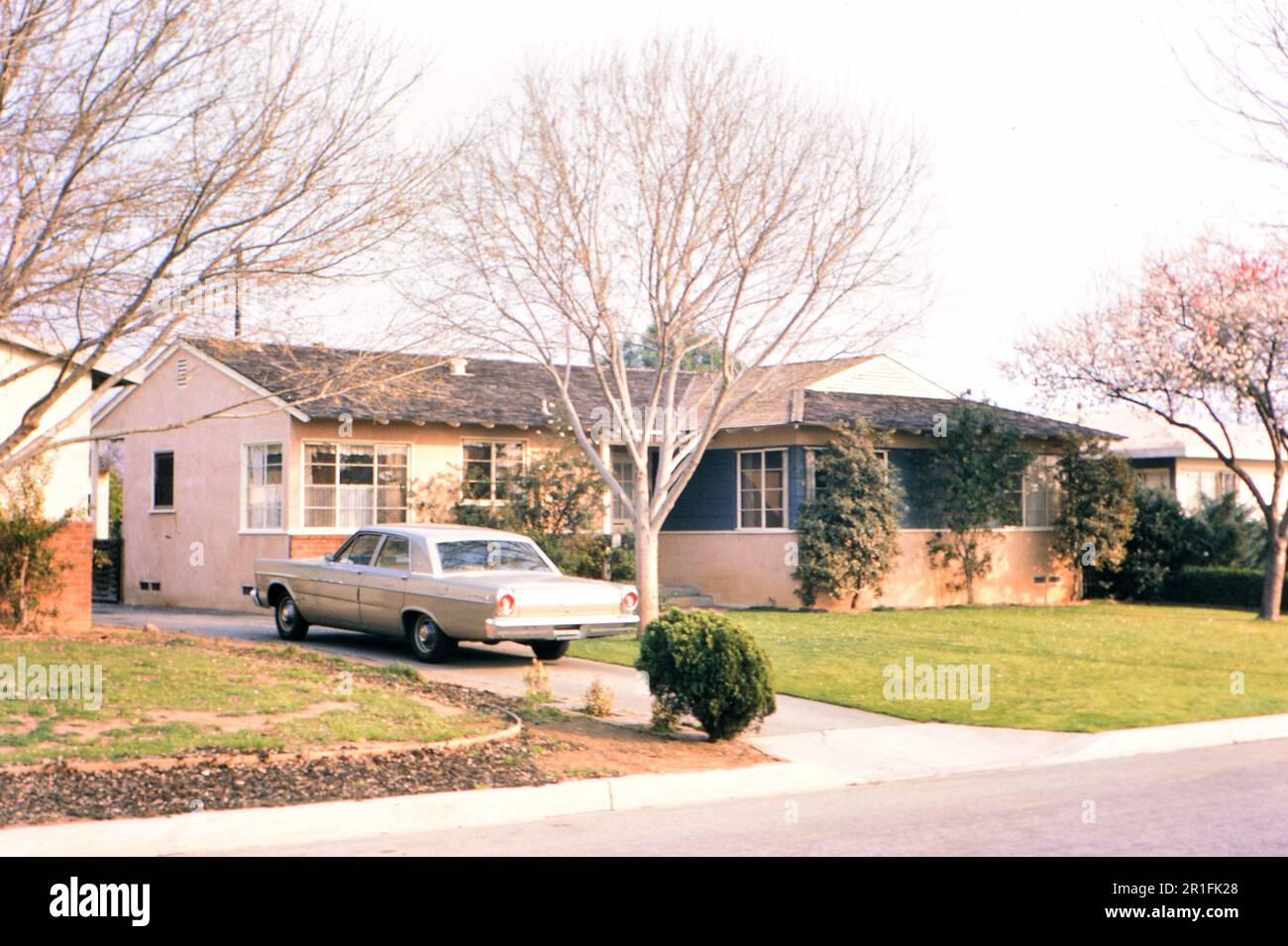 Car parked in the driveway of a suburban home ca. 1965 Stock Photo - Alamy