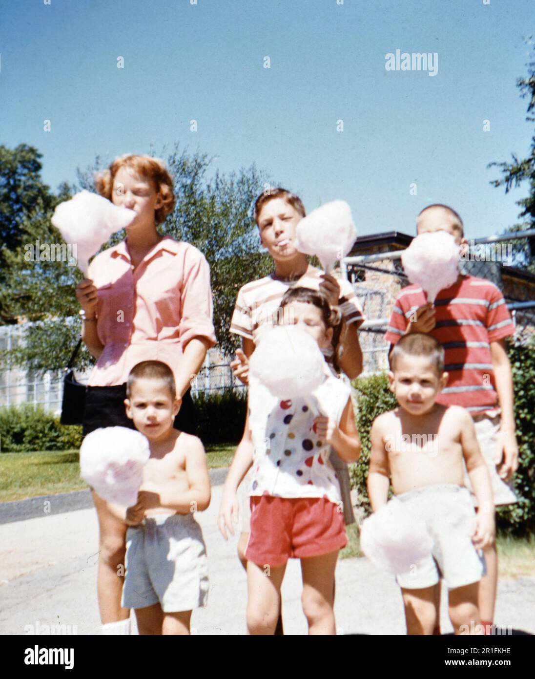 Children eating cotton candy during a trip to the Dallas Zoo ca. 1959 ...