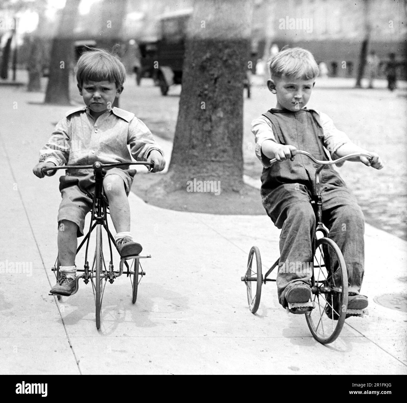 Archival Photo: Children having fun riding on tricycles ca. 1910s or ...
