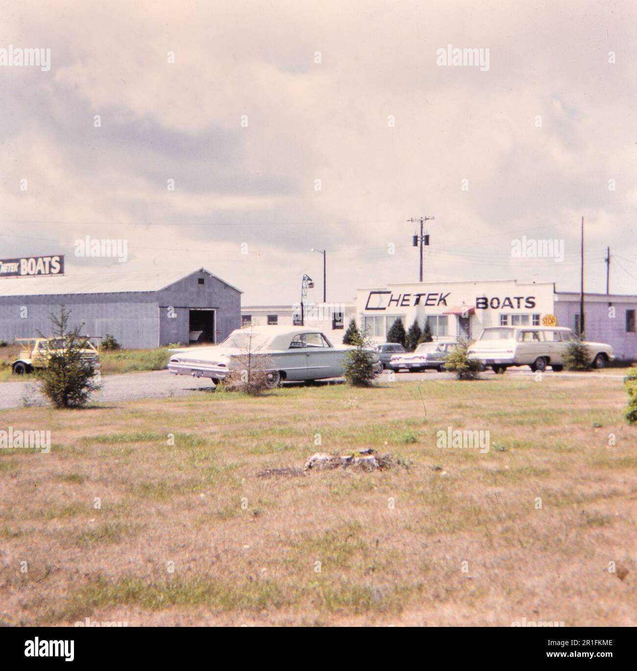Cars parked outside the Chetek Boat company ca. 1964 Stock Photo - Alamy