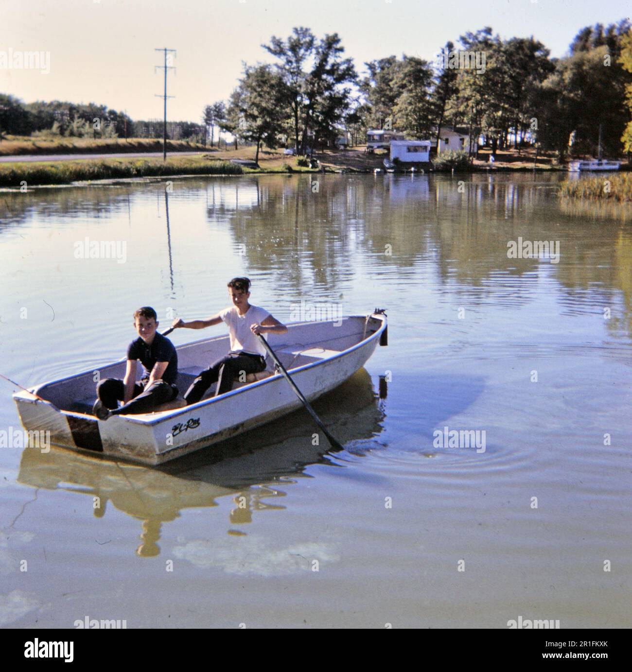 1960s boys in a row boat hi-res stock photography and images - Alamy