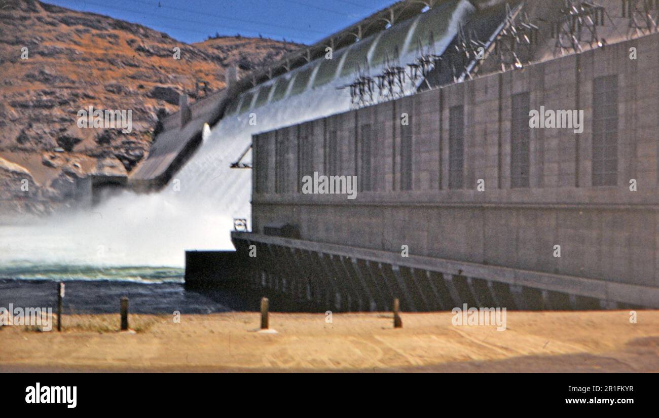 Water flowing through the flood gates of a dam, possibly Hoover Dam ca ...