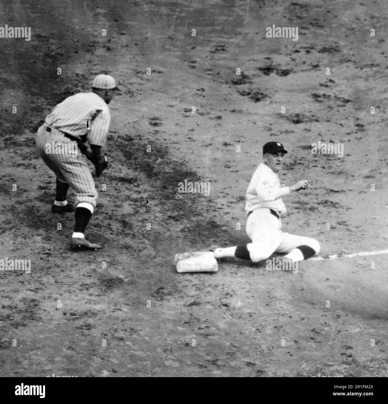 Archival Photo: Joe Judge, of the Washington Nationals, sliding safely ...
