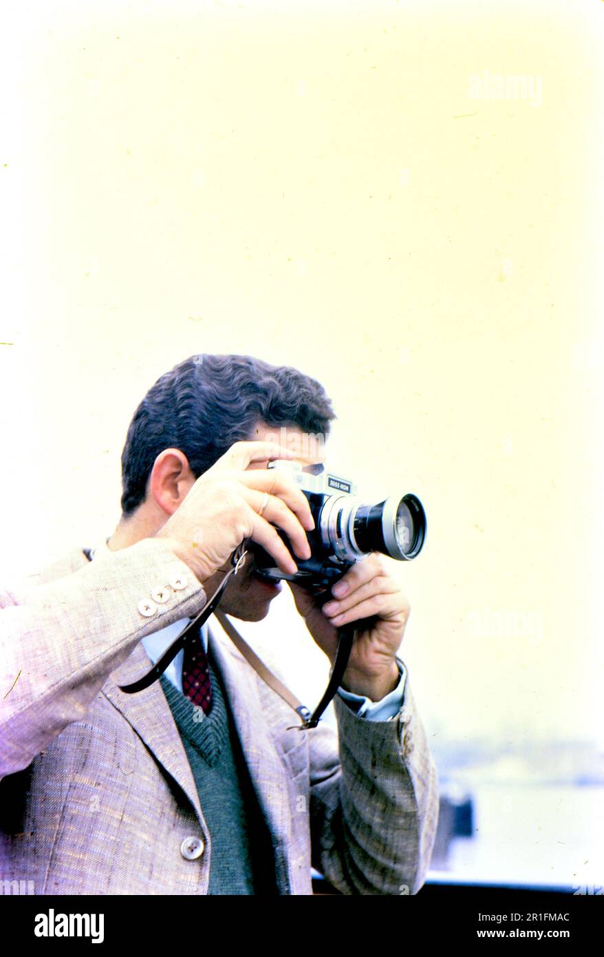 Man facing right, using a Zeiss camera ca. 1969 Stock Photo - Alamy