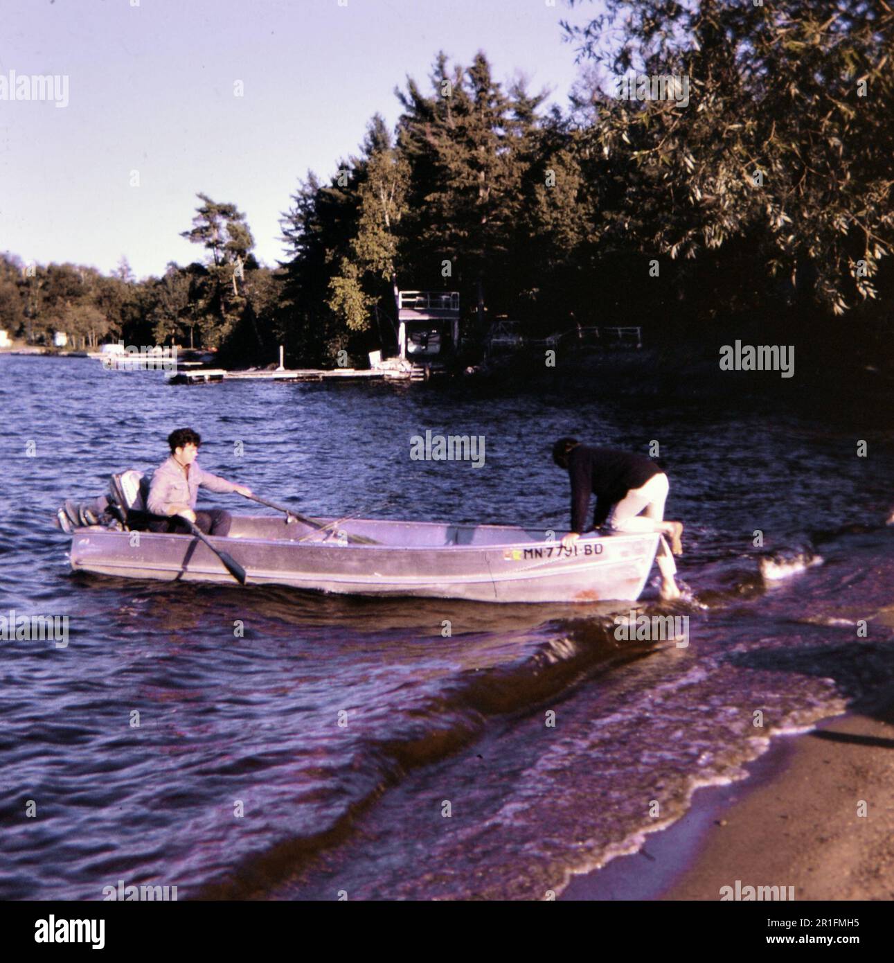 1960s boys in rowboat hi-res stock photography and images - Alamy