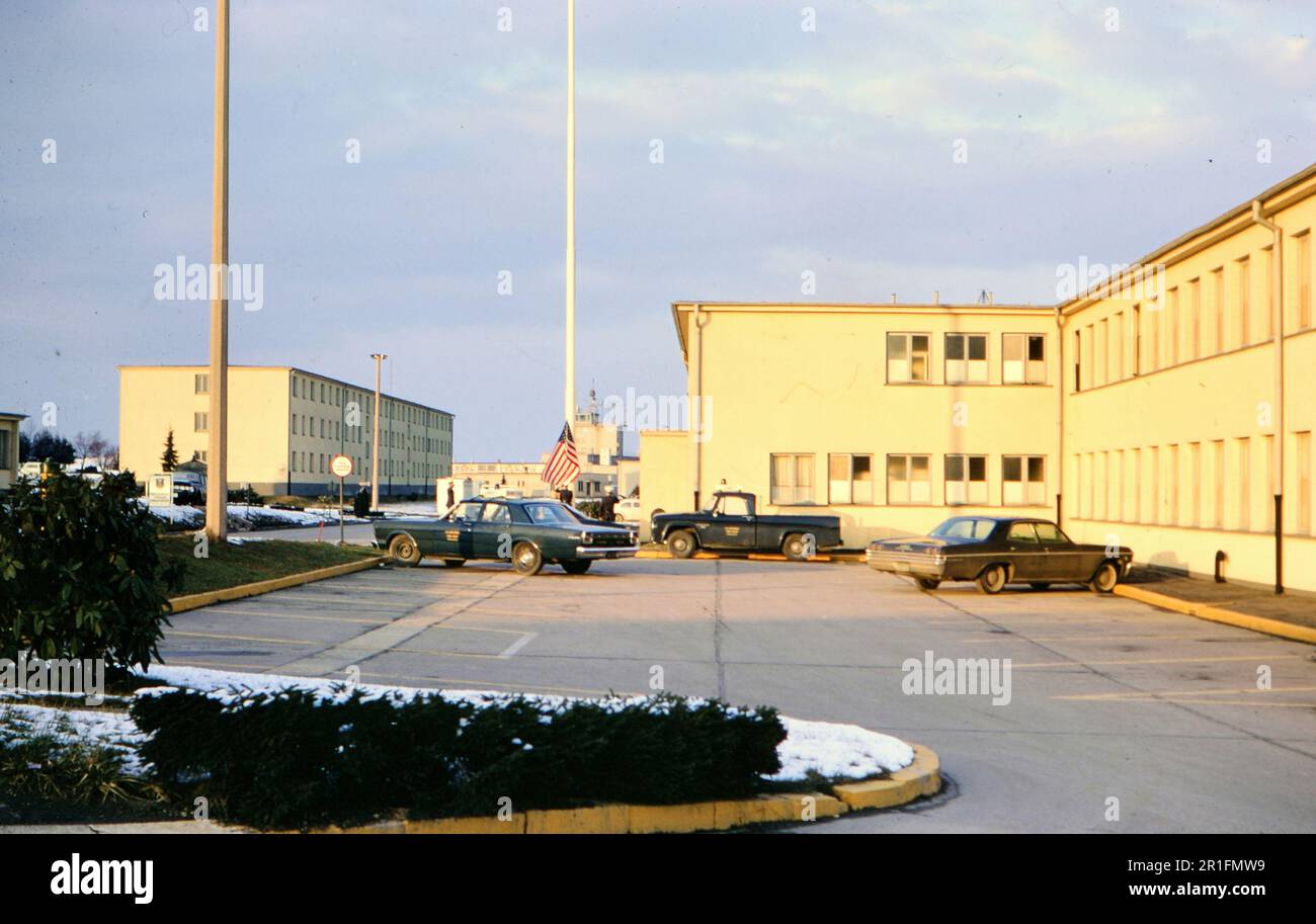 U.S. Military raising a flag on a government installation, possibly an ...