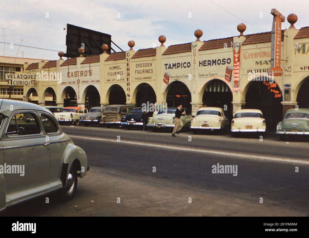 Man running across a street in Tijuana Mexico ca. 1956 Stock Photo - Alamy