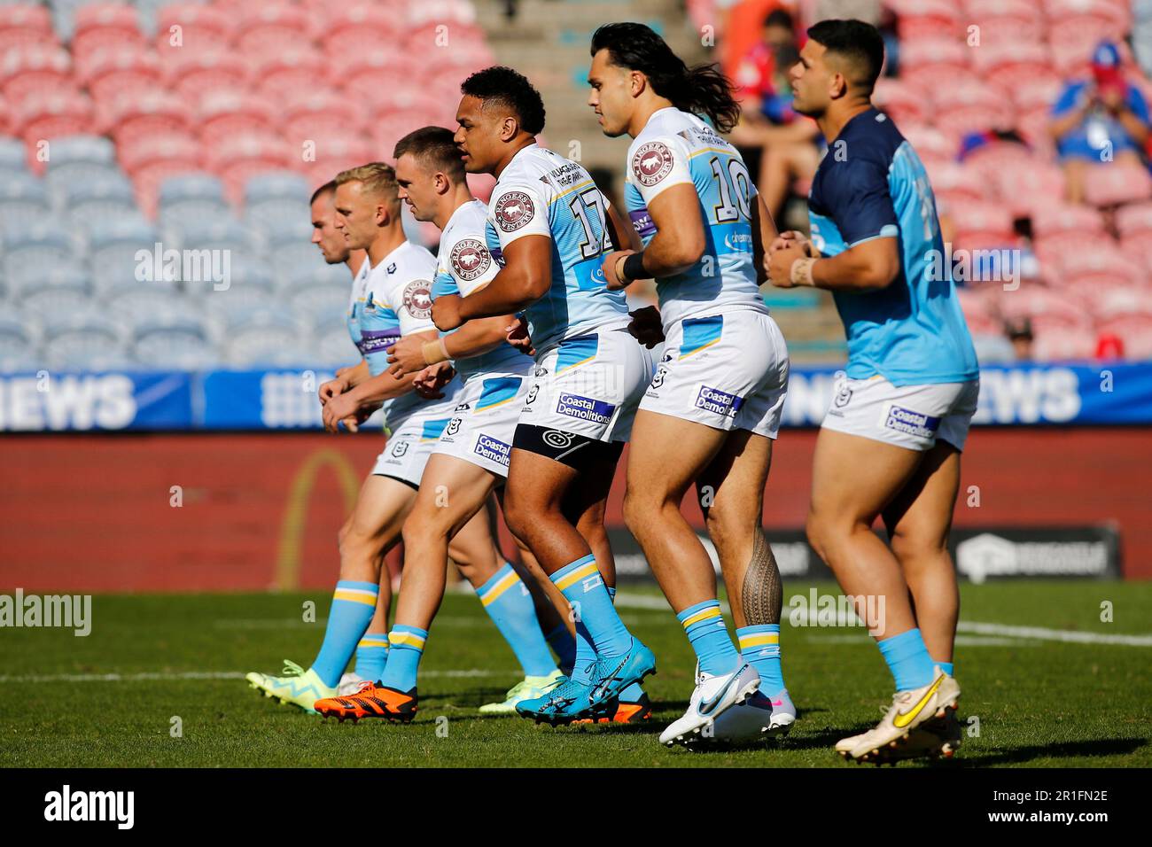 Titans players warm up before the NRL Round 11 match between the ...