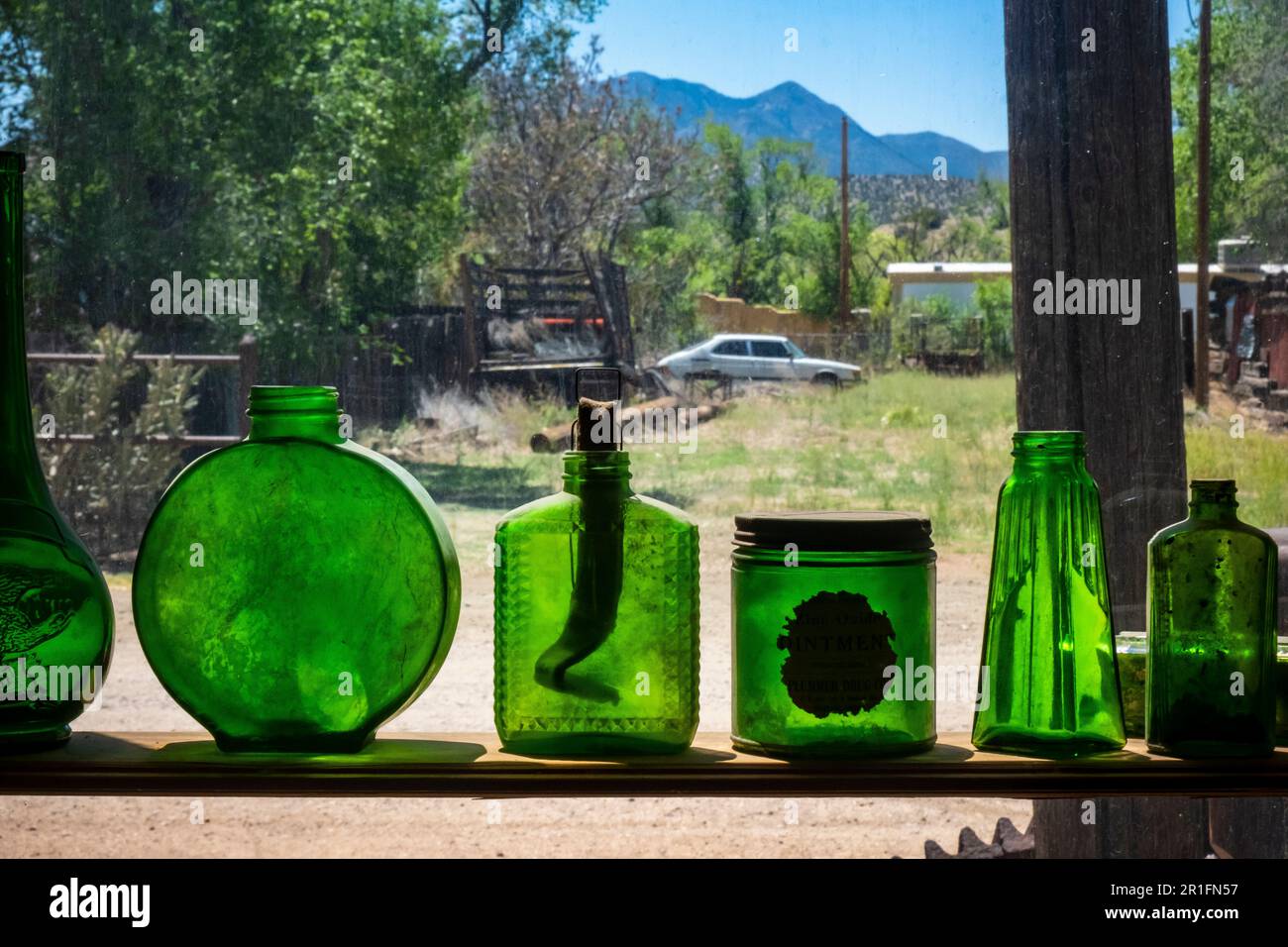 Colorful glass bottles in a window at the Turquoise Mining Museum in ...
