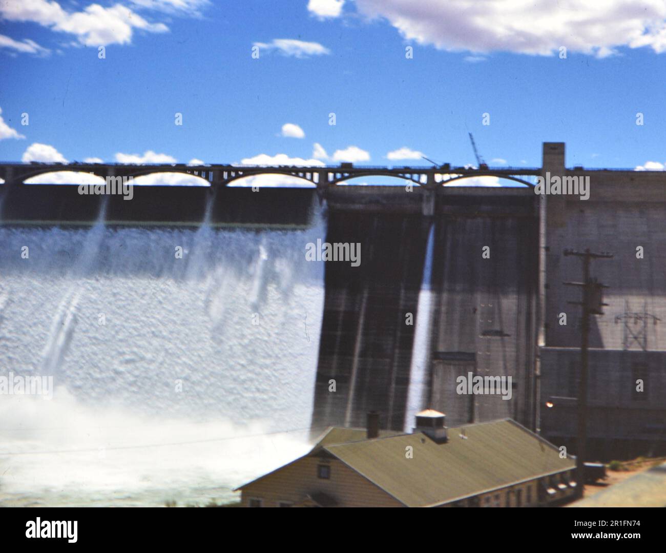 Water flowing through the flood gates of a dam, possibly Hoover Dam ca ...