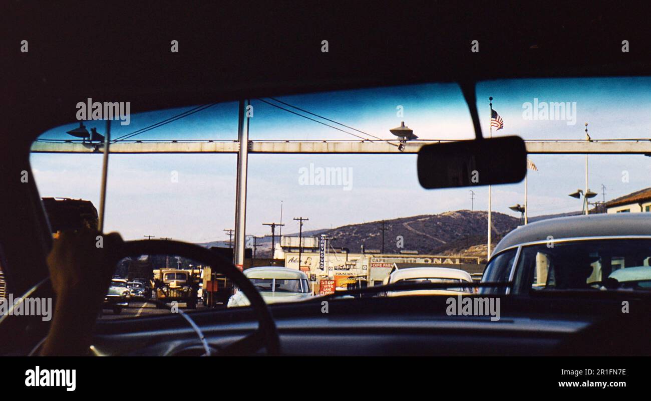 View of traffic through a windshield of a car, photo taken from back ...
