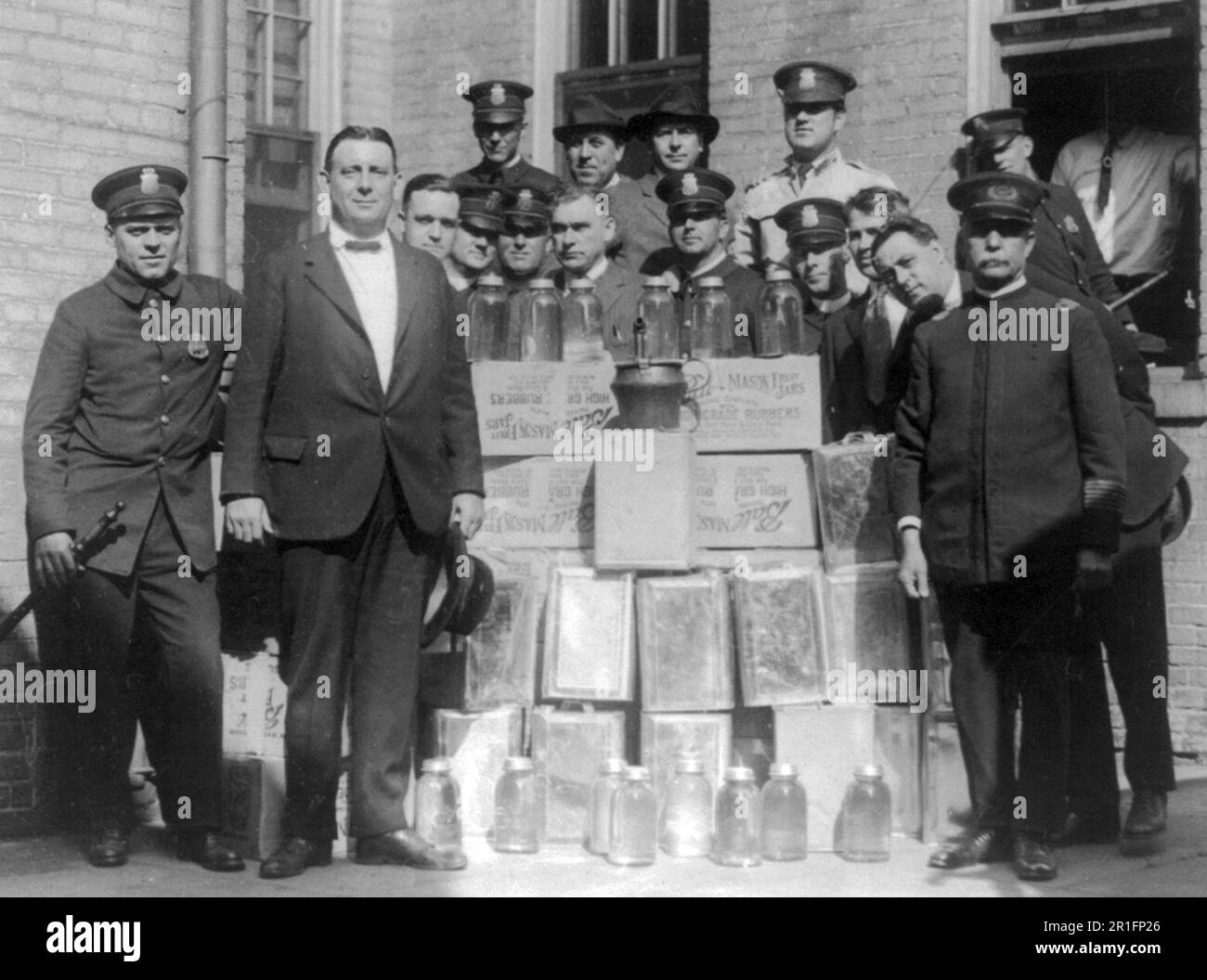 Archival Photo: Group of policemen posed with cases of moonshine during ...