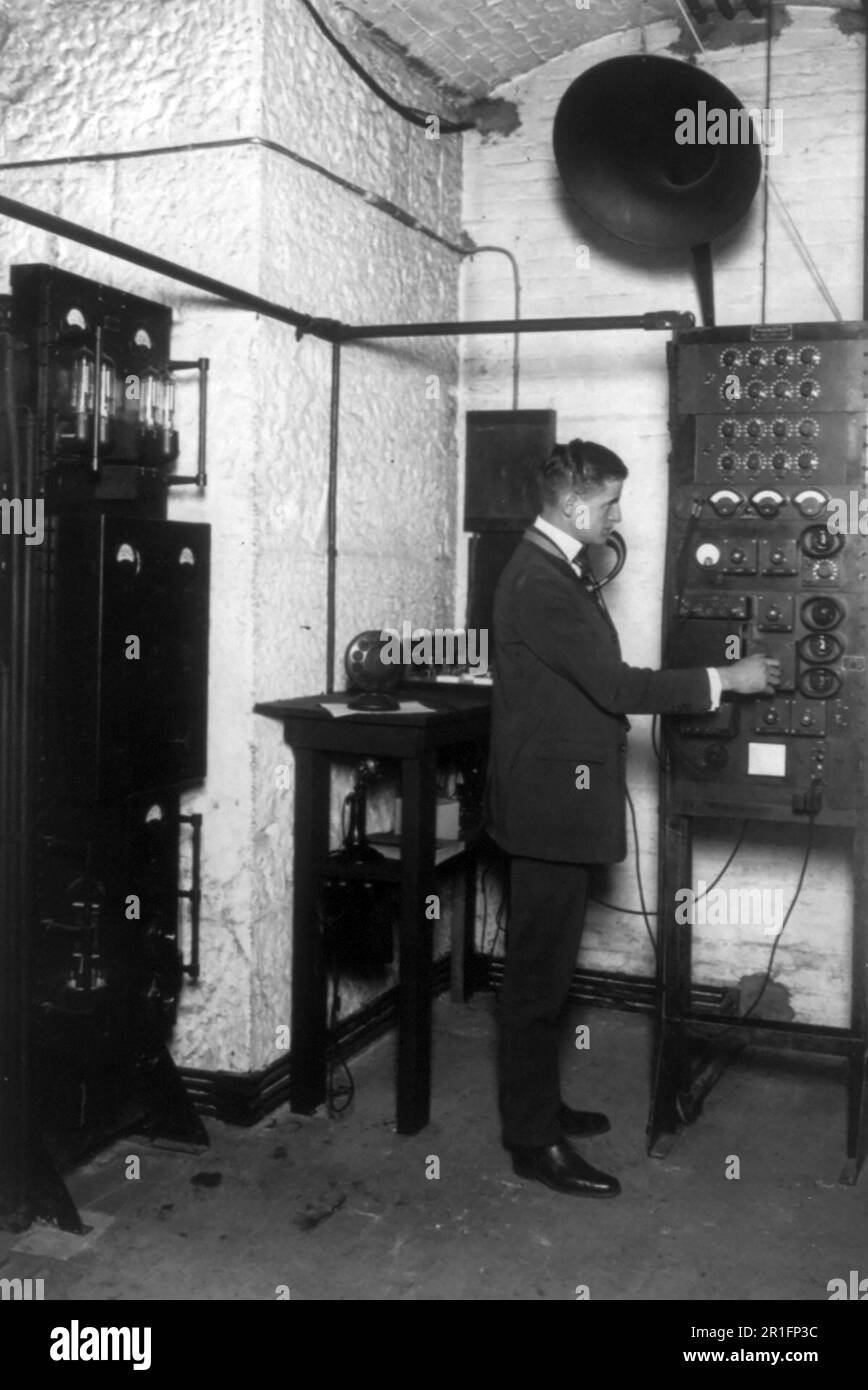 Archivial Photo: Man in public address amplifier control room in the U ...