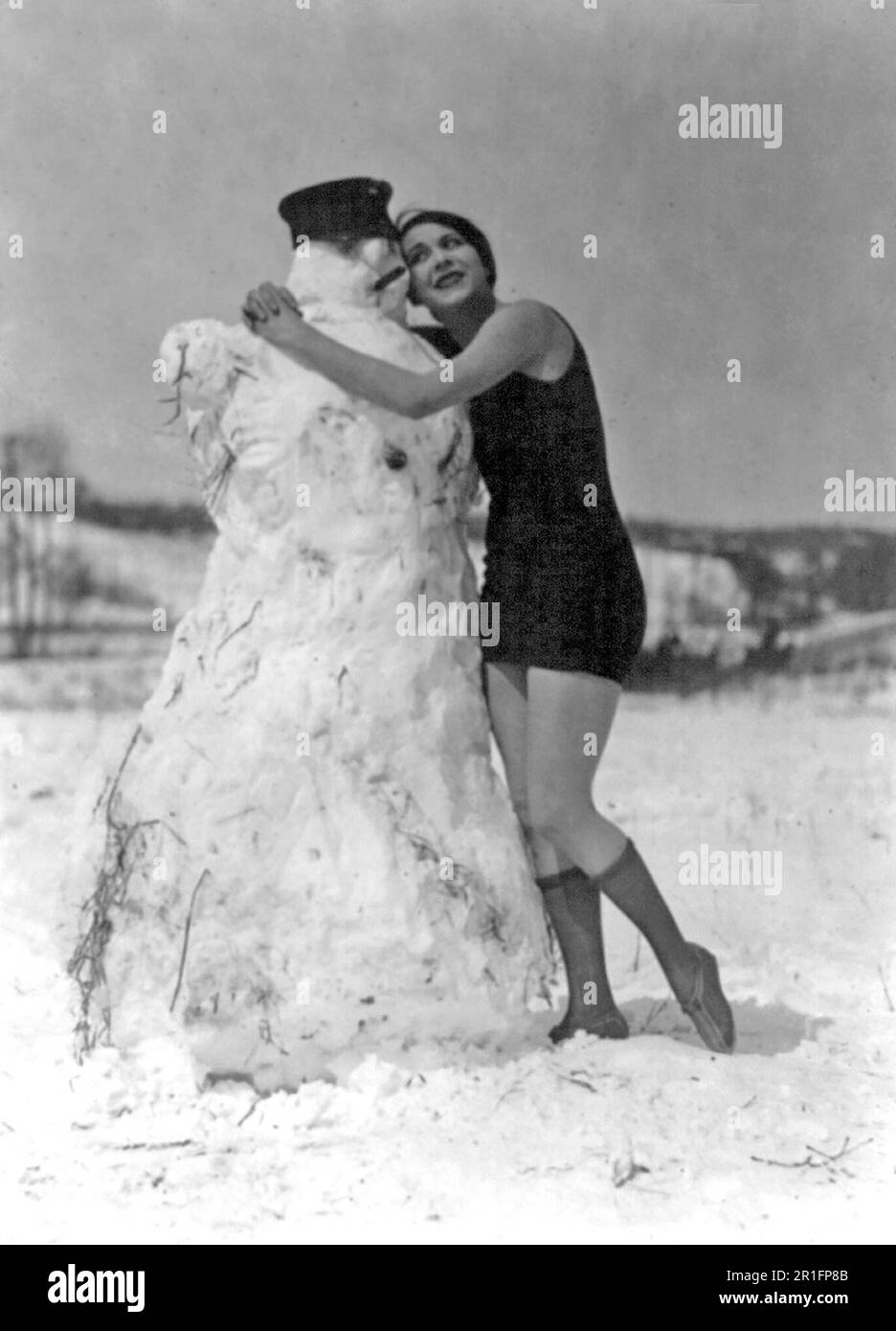 Archival Photo: Miss Fritzi Ridgeway hugging a snowman ca. 1924 Stock ...