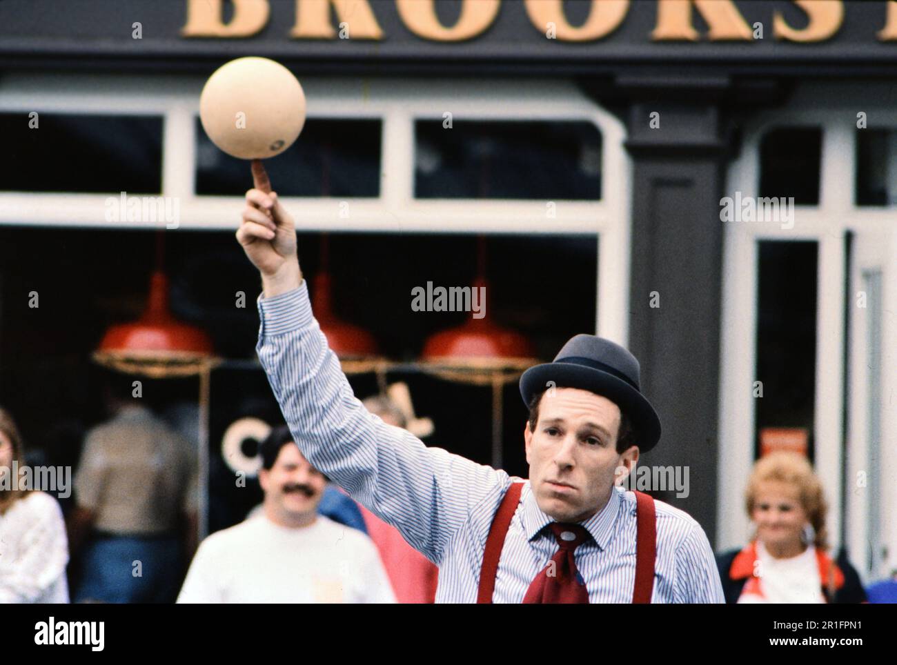 Balancing a ball on one finger hi-res stock photography and images - Alamy