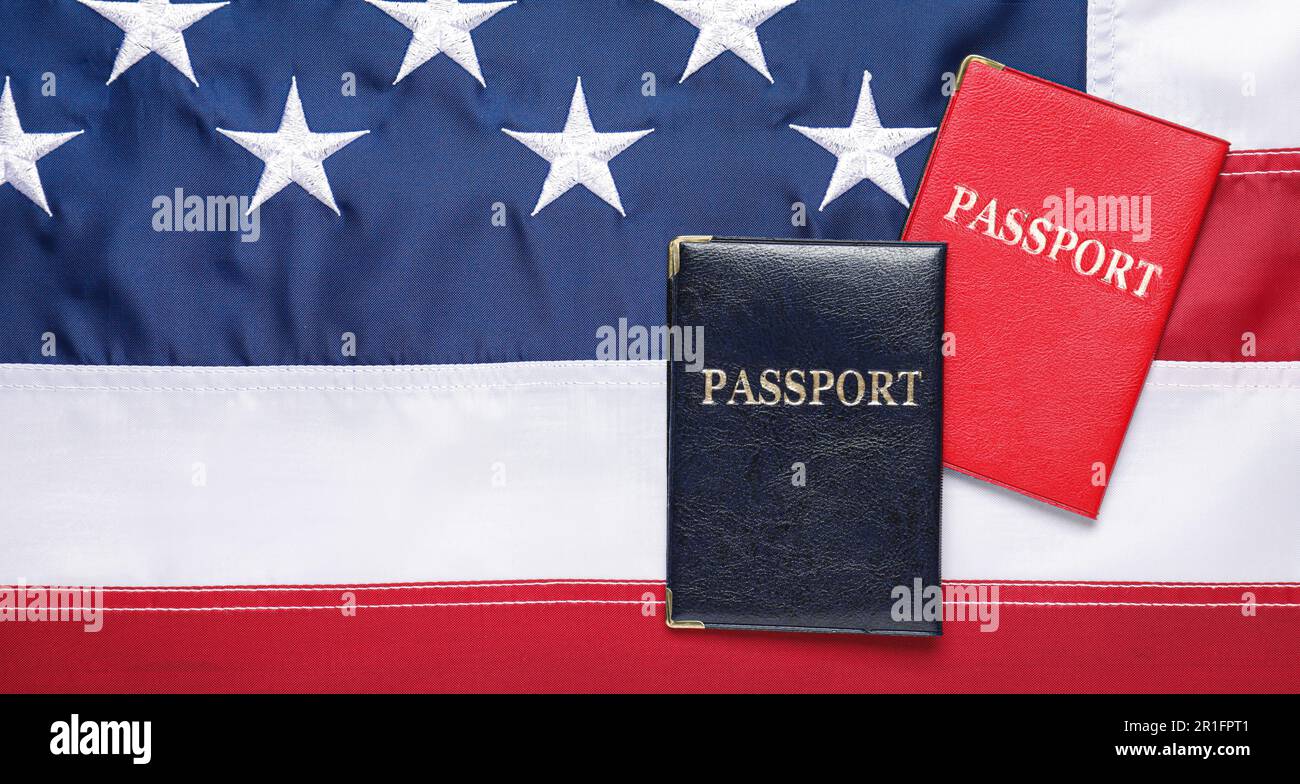 Passports on USA flag. Immigration concept Stock Photo - Alamy