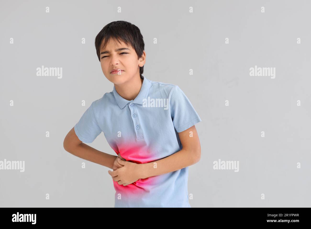 Little boy suffering from appendicitis on light background Stock Photo ...