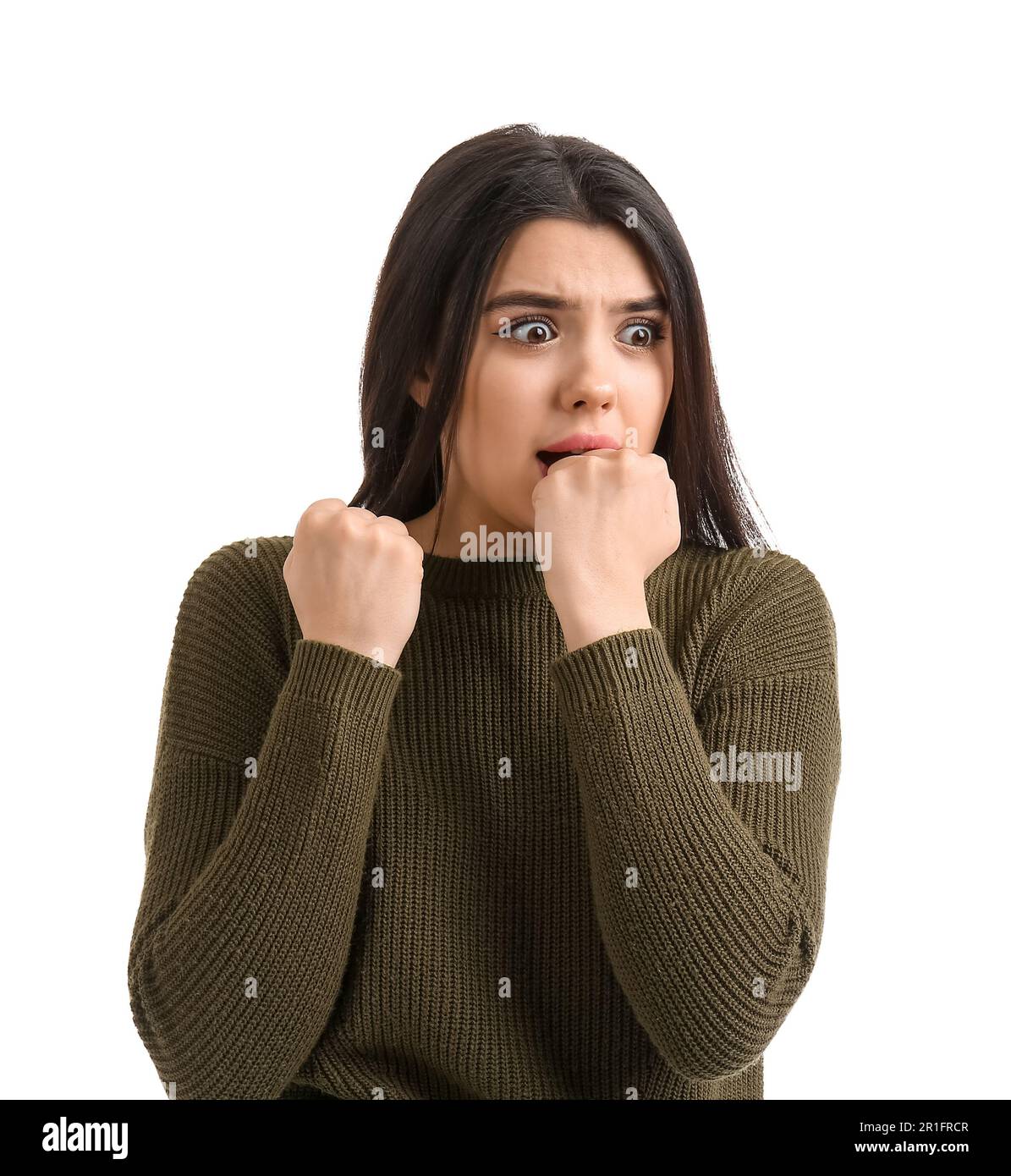 Scared young woman on white background Stock Photo - Alamy