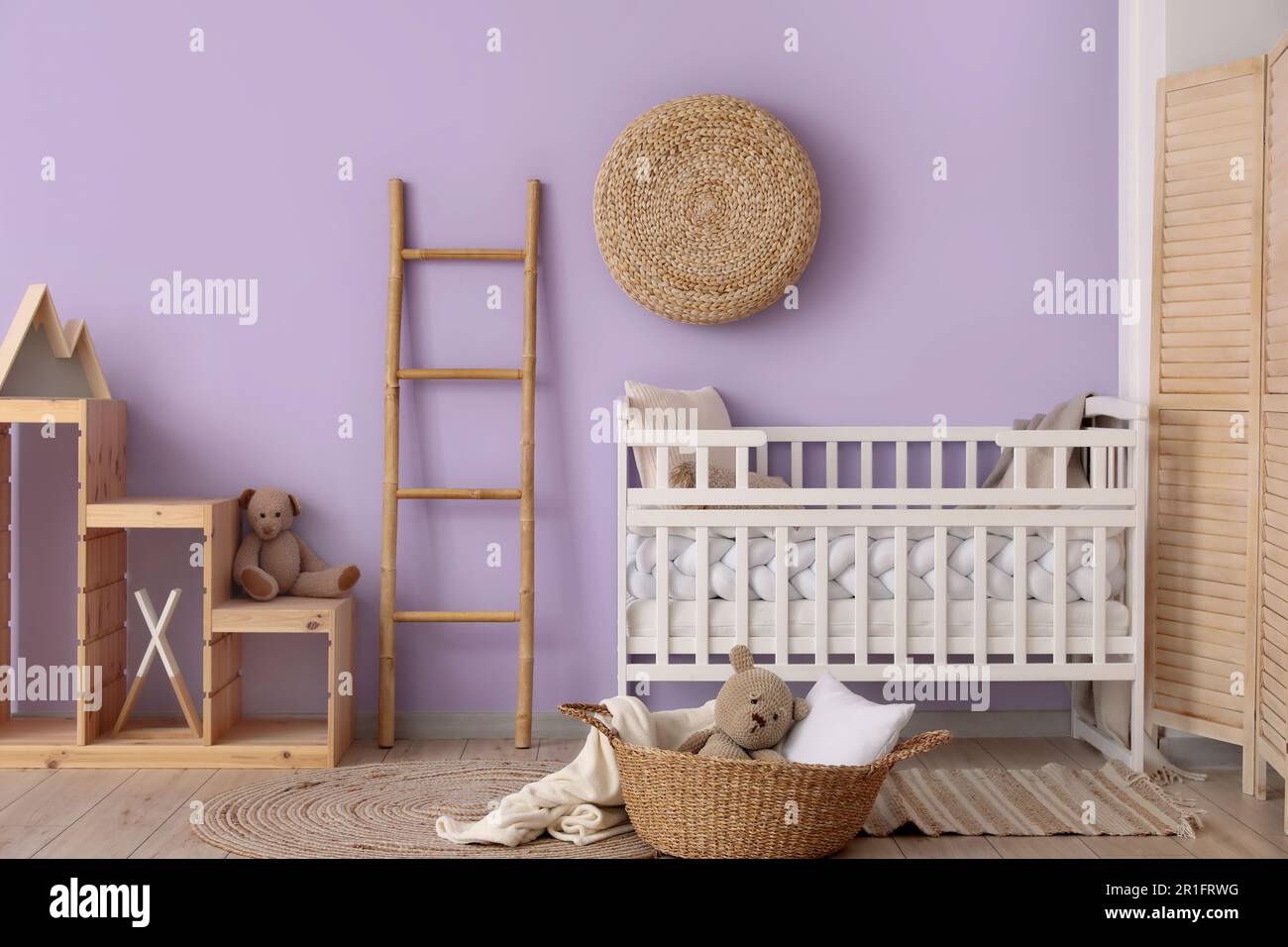 Interior of children's room with crib, ladder and shelves Stock Photo ...
