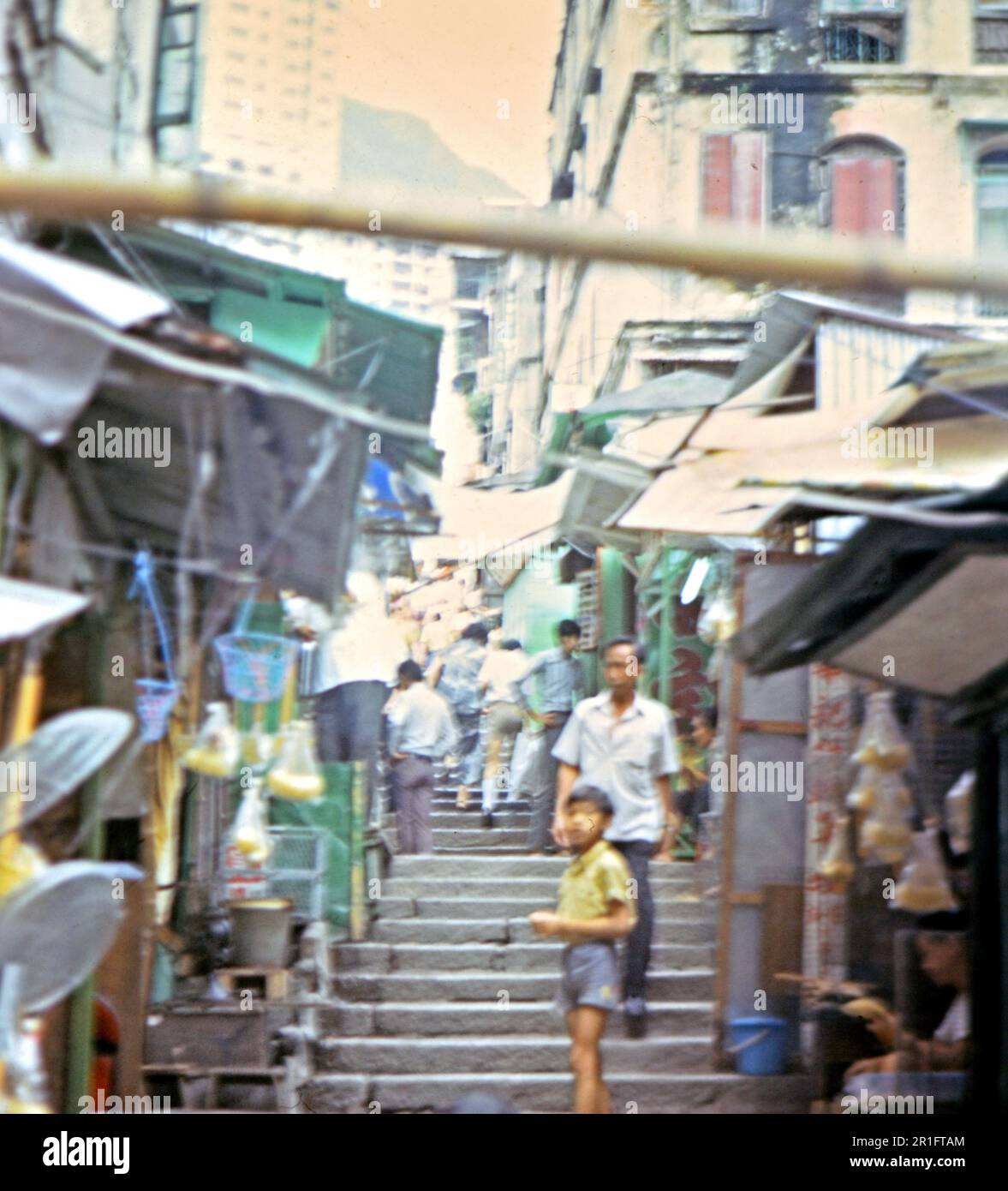 Pedestrians walking in the Cat Street area of Hong Kong ca. 1973 Stock ...