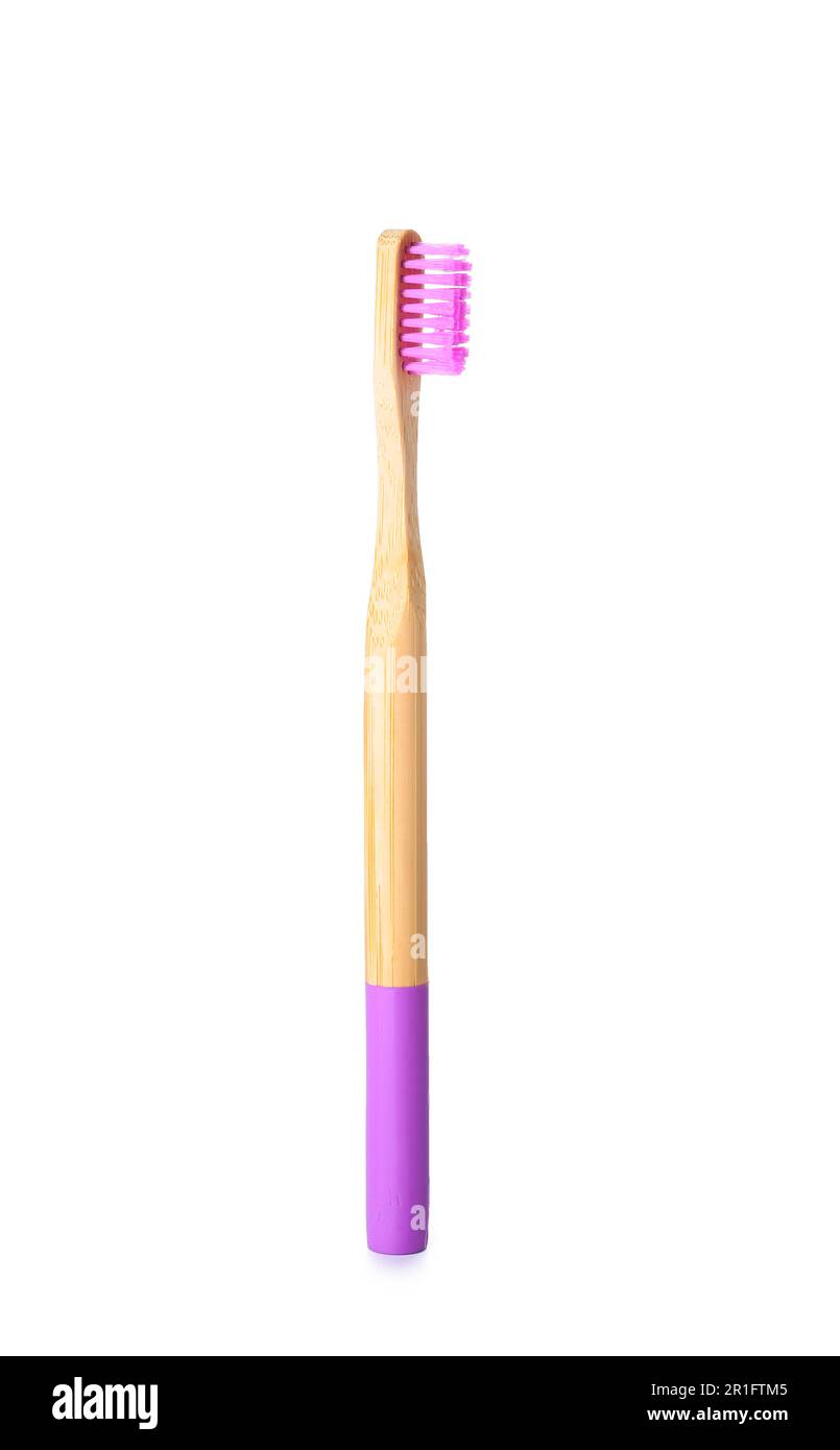 Purple bamboo toothbrush isolated on white background Stock Photo - Alamy