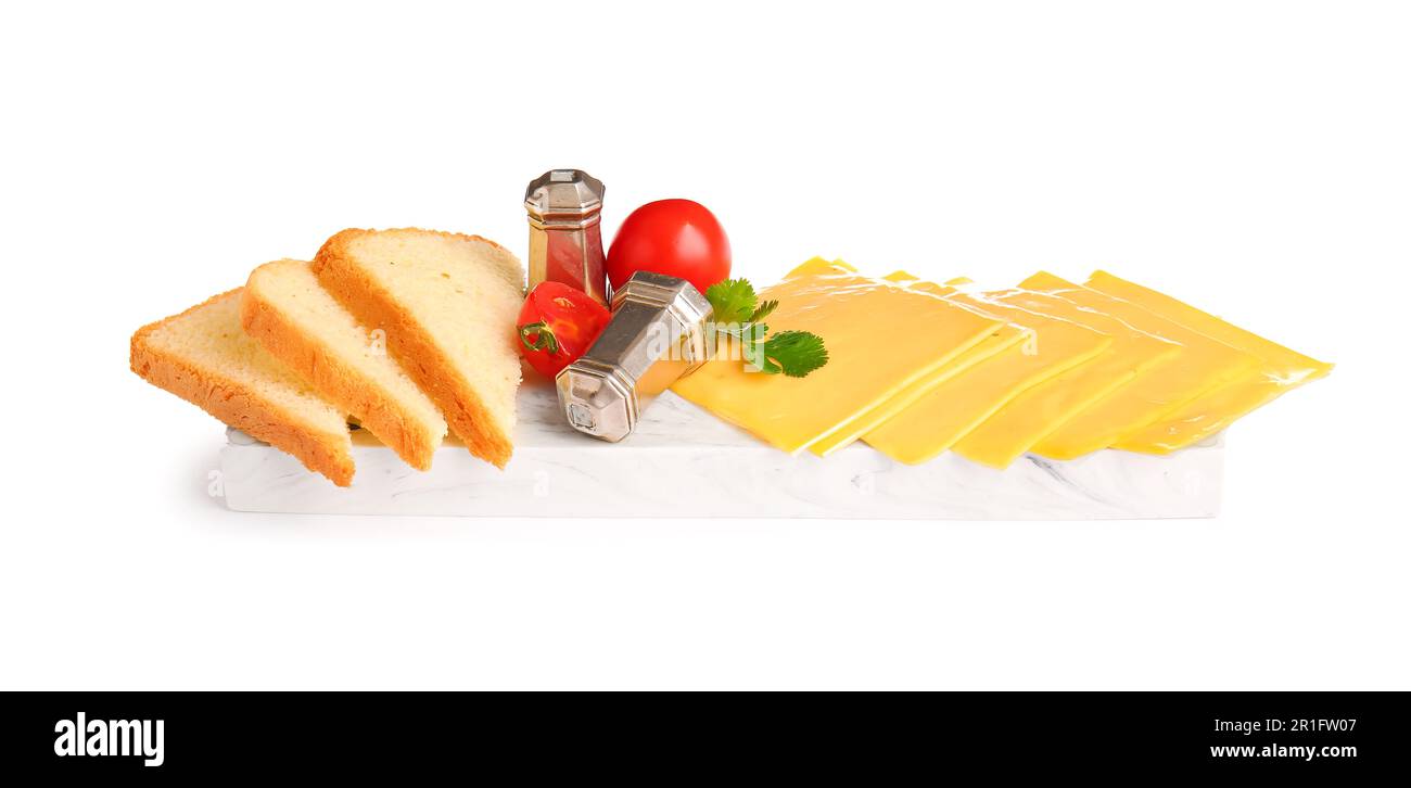 Board of tasty processed cheese with bread and spices on white ...