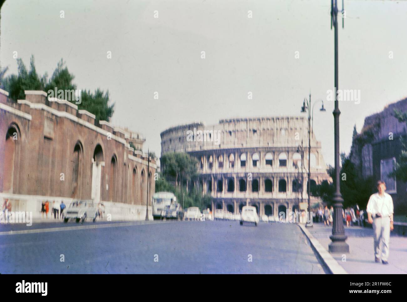 Street scene in Rome with the Colosseum in the background ca. 1966-1972 ...