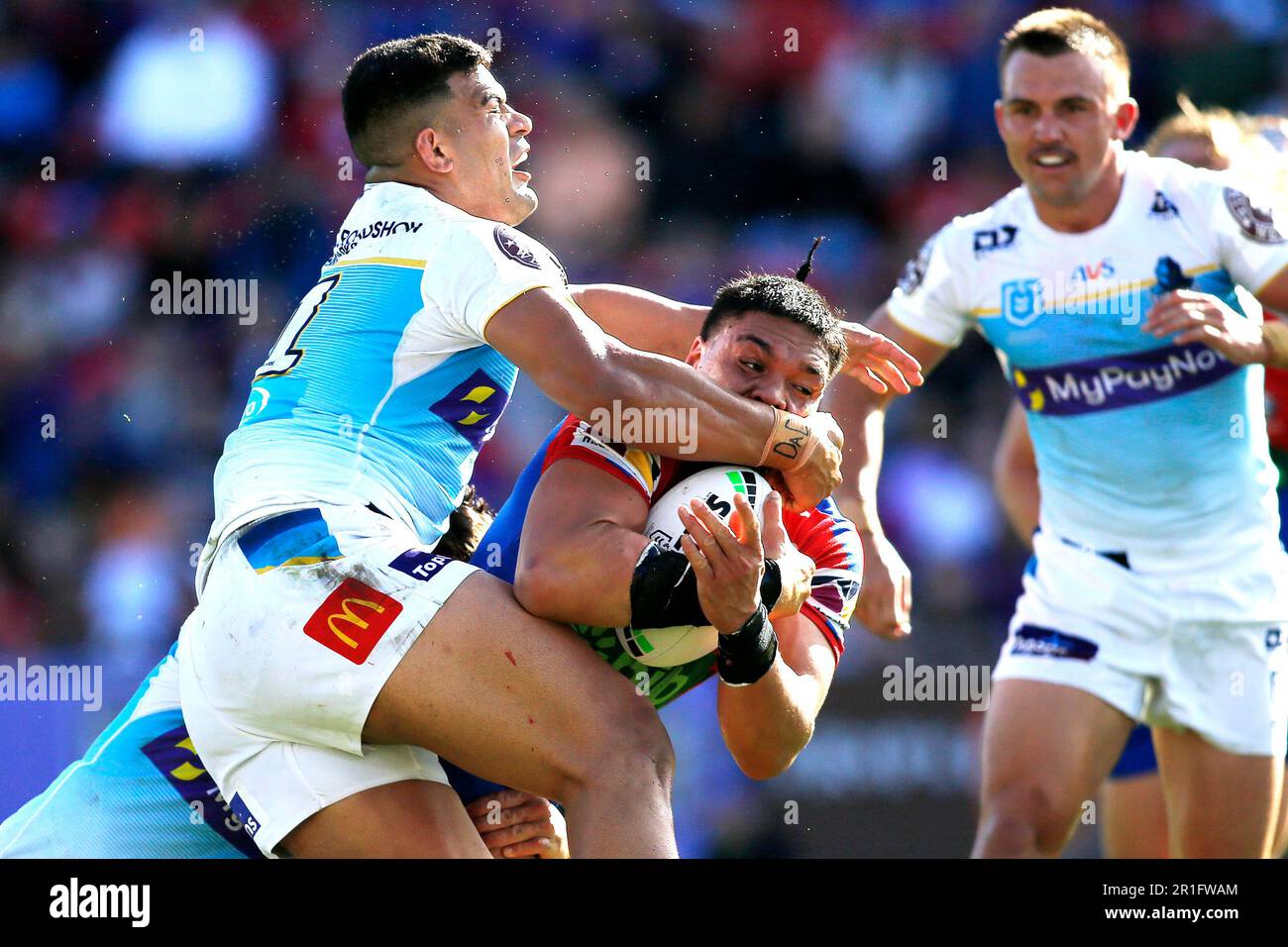 Leo Thompson of the Knights cops a high shot during the NRL Round 11 ...