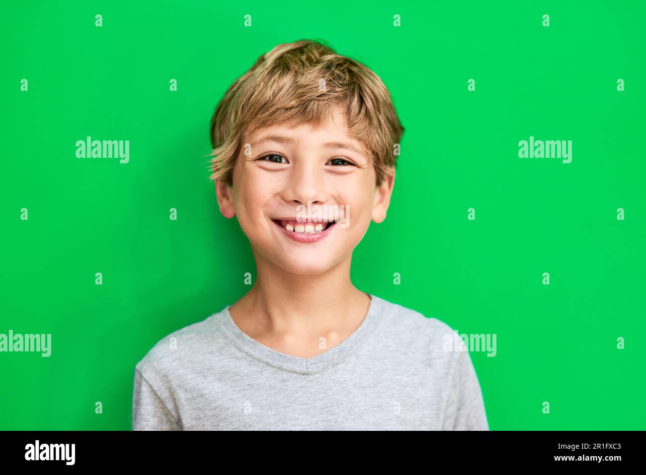 Portrait, green screen and boy with a smile, mockup and confident kid ...
