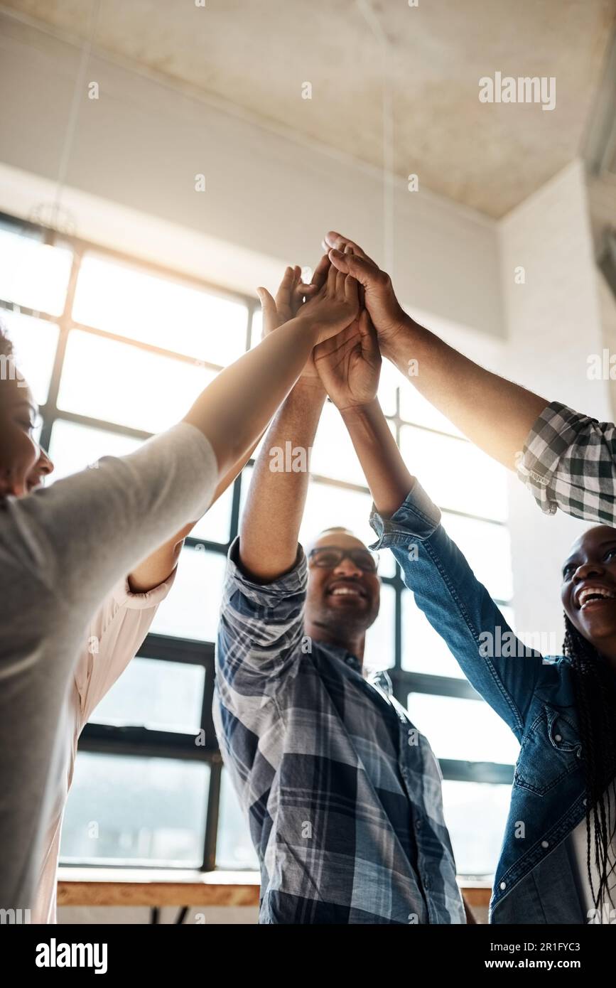 Team, startup and group with high five, teamwork and achievement with ...