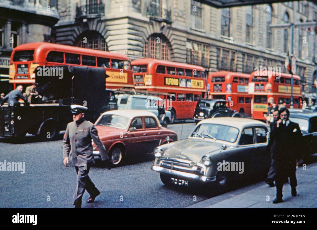Street scene in London England, traffic, pedestrians and red double ...