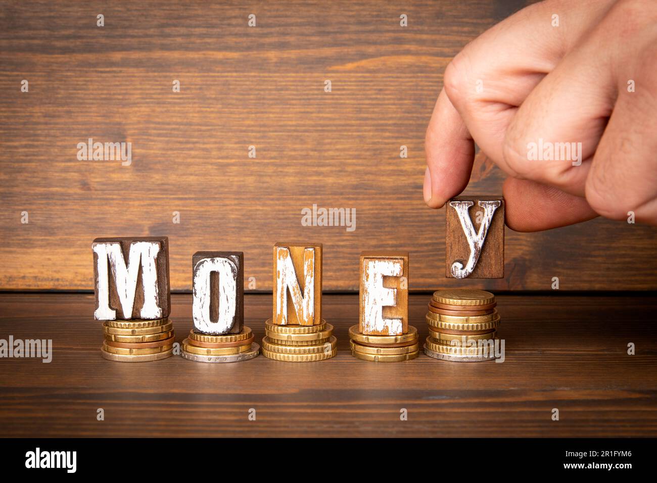 MONEY Concept. Text from wooden alphabet letters and change Stock Photo ...