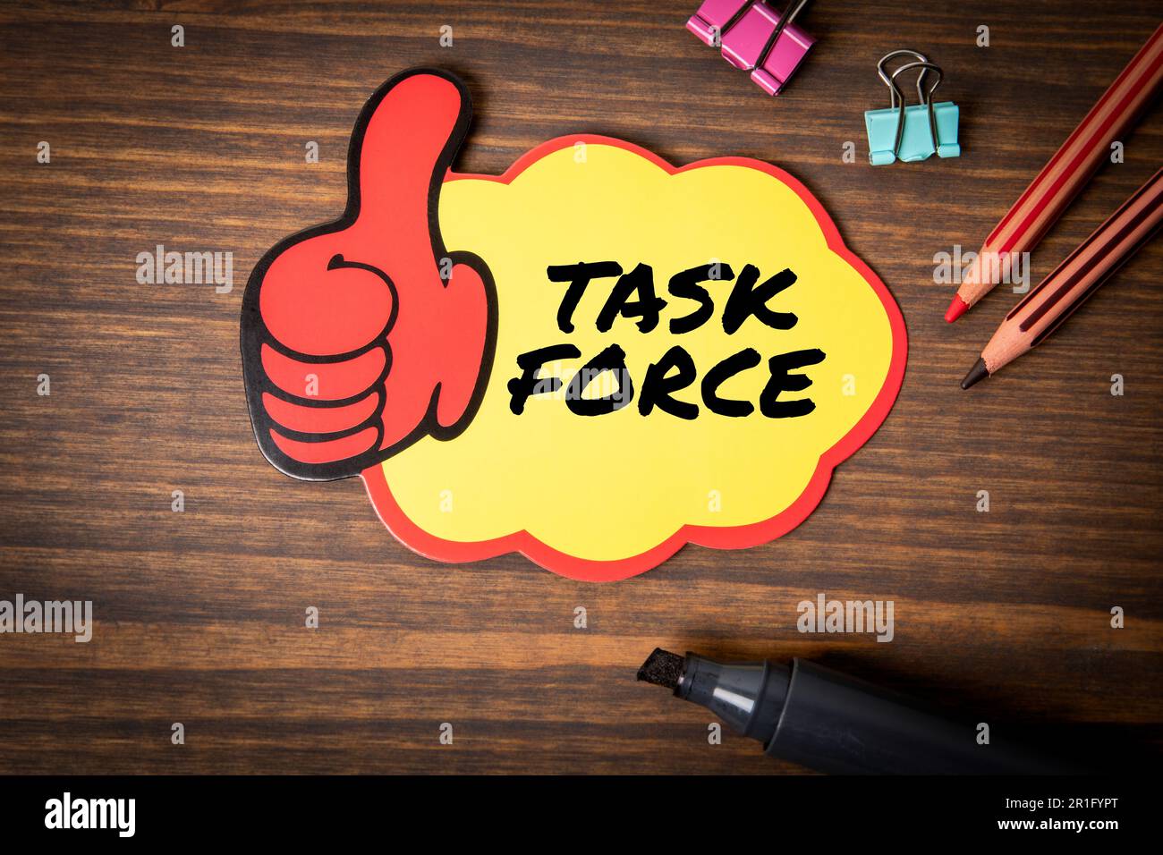 Task Force. Sticky note with text on wooden texture office table Stock ...