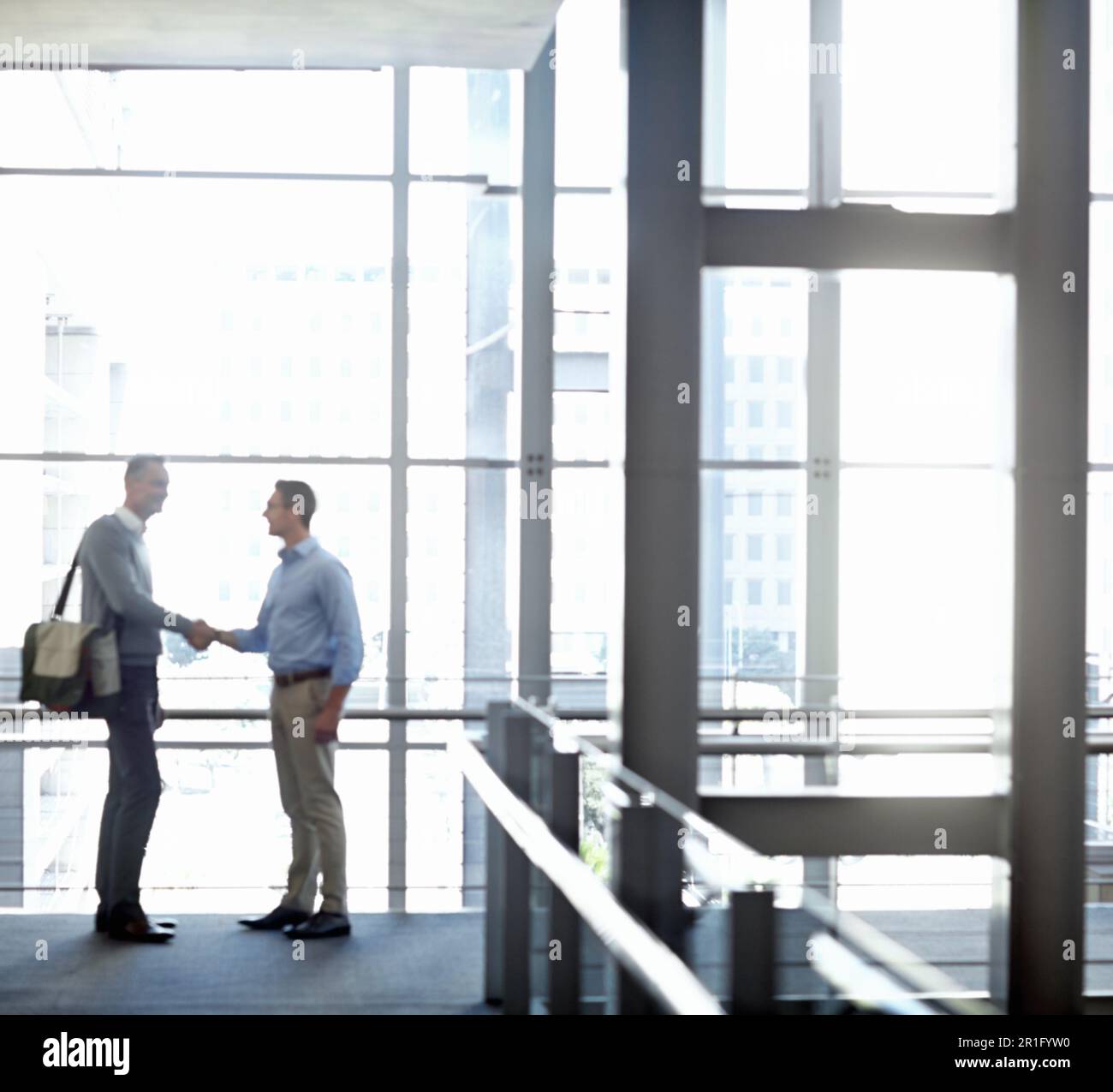 Business people, handshake or greeting in hotel lobby, modern office or ...